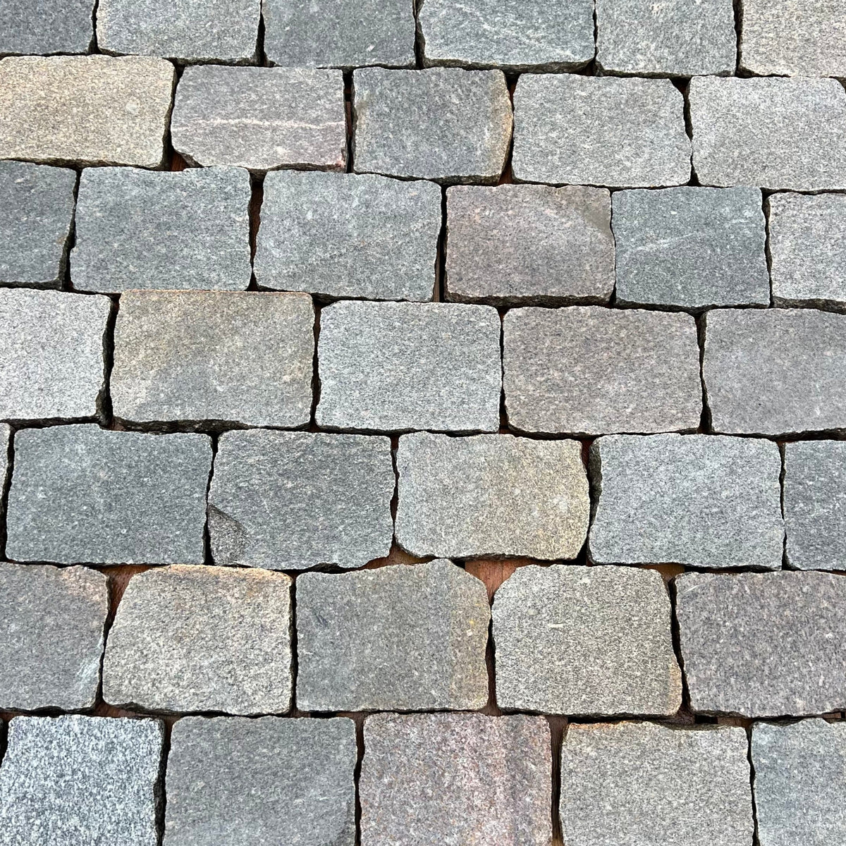 Reclaimed Smooth Granite Cobble Tops - Per SQM – Britannia Stone